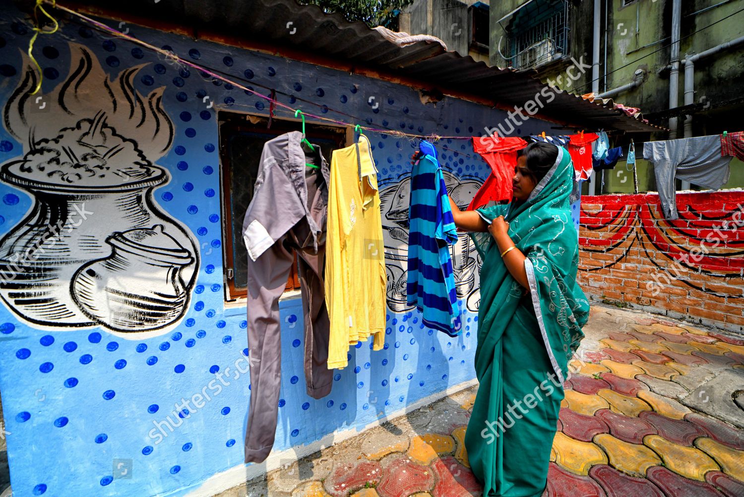 WOMAN HANGS CLOTHES ON WIRE NEAR Editorial Stock Photo - Stock Image ...
