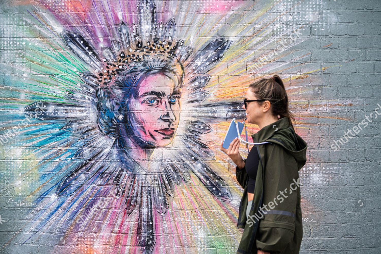 PEDESTRIAN WALKS PAST MURAL BY ARTIST Editorial Stock Photo - Stock ...