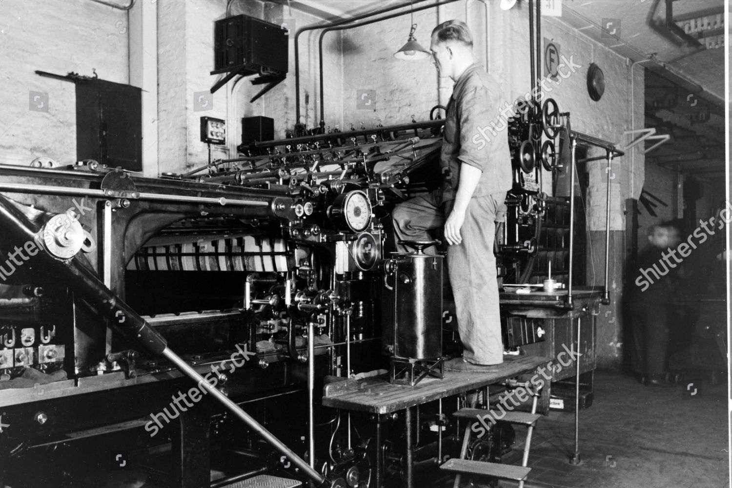 Worker Controlling Rotary Printing Press Plants Editorial Stock Photo worker-controlling-rotary-printing-press-plants-editorial-stock-photo