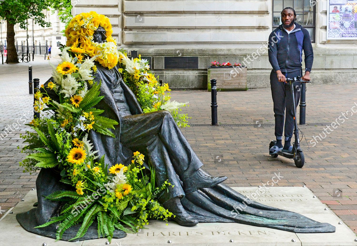 Man On Electric Scooter Admires Statue Editorial Stock Photo - Stock ...