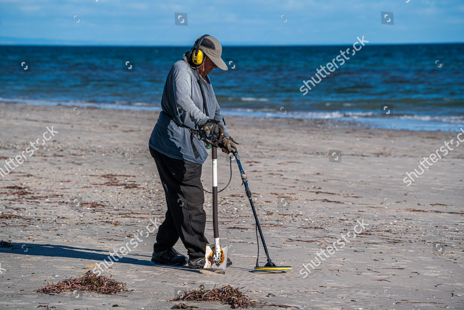 Metal Detectorist Scouring Beach On Sunny Editorial Stock Photo - Stock ...