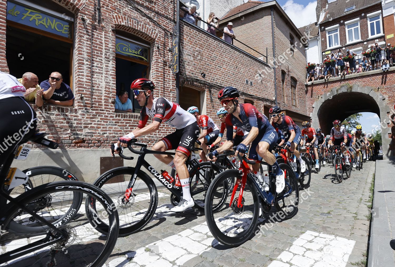 Riders Pass Through Cobblestone Section During Editorial Stock Photo ...