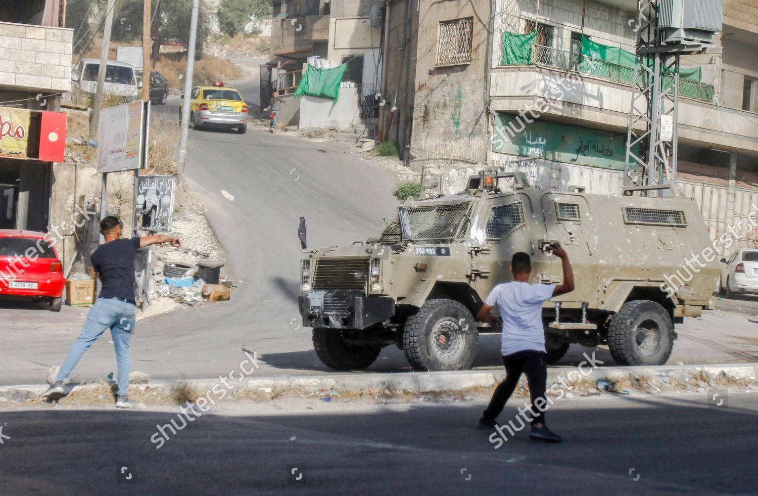 Palestinian Youths Throw Stones Military Vehicle Editorial Stock Photo ...