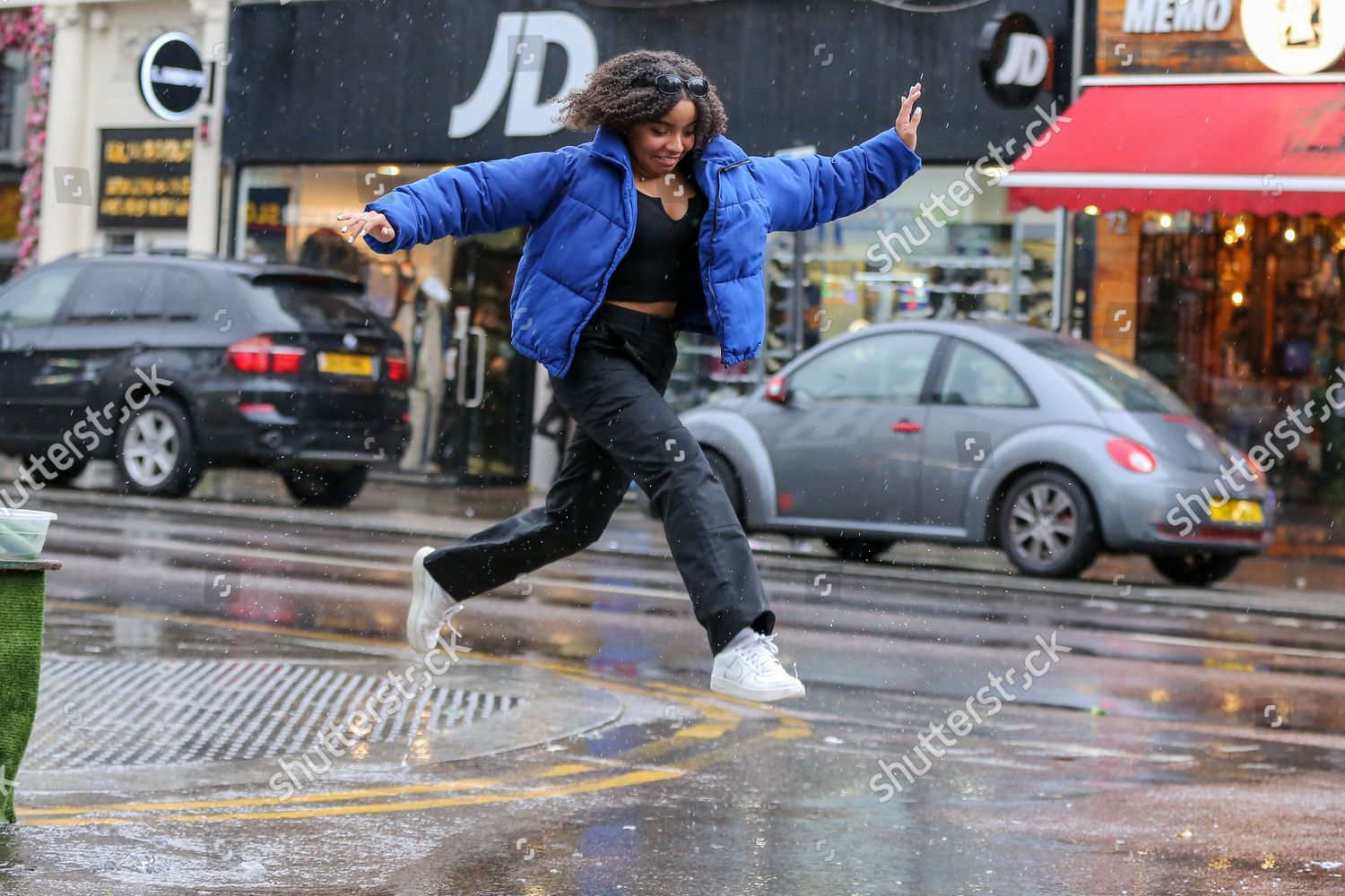 Woman Jumps Over Large Puddle Rainwater Editorial Stock Photo - Stock ...