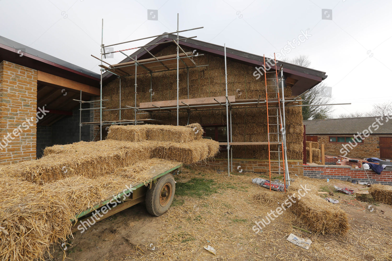 Builders Using Straw Insulation On New Editorial Stock Photo - Stock ...
