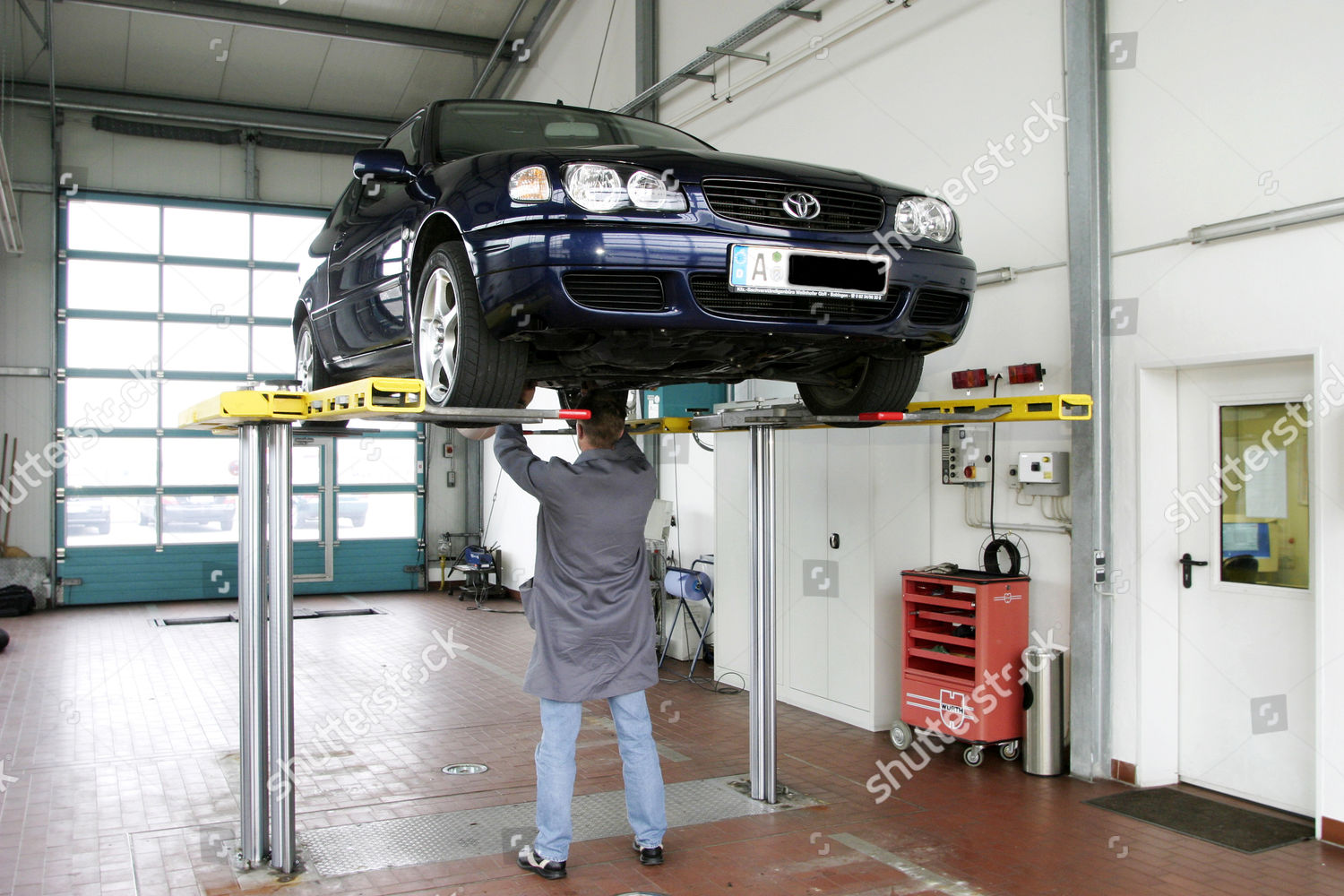 Man Examining Car Workshop Editorial Stock Photo - Stock Image ...