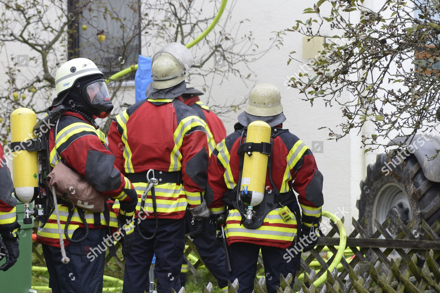 Firefighters Wearing Breathing Equipment While Extinguishing Editorial ...