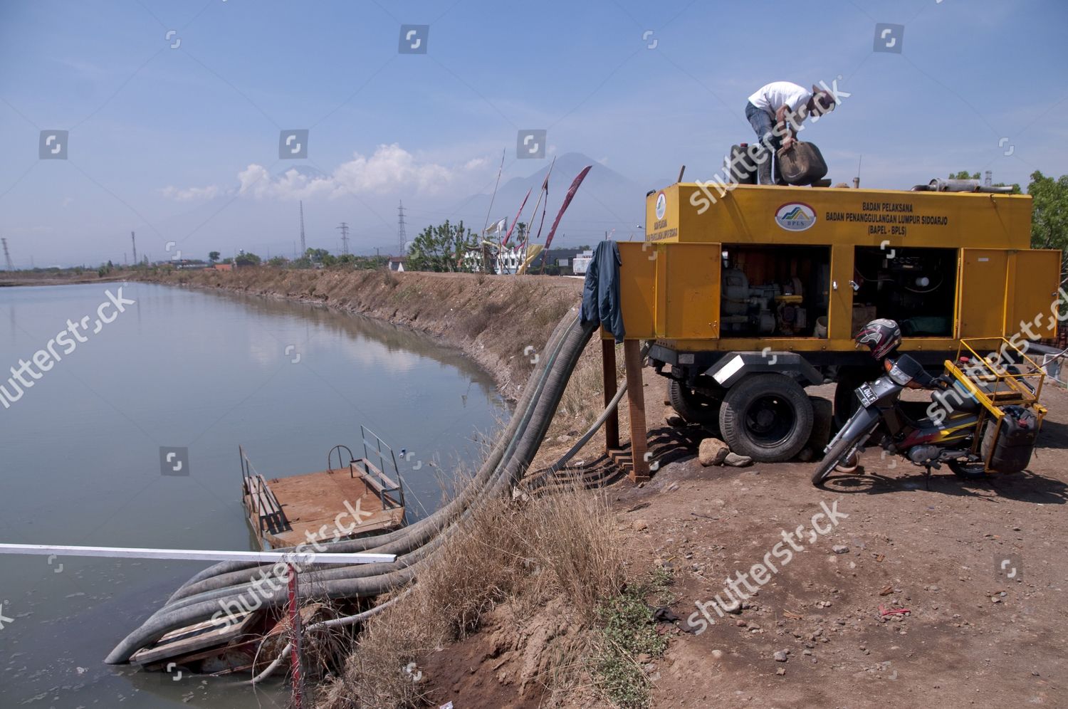 Worker On Levee Using Water Pump Editorial Stock Photo - Stock Image ...