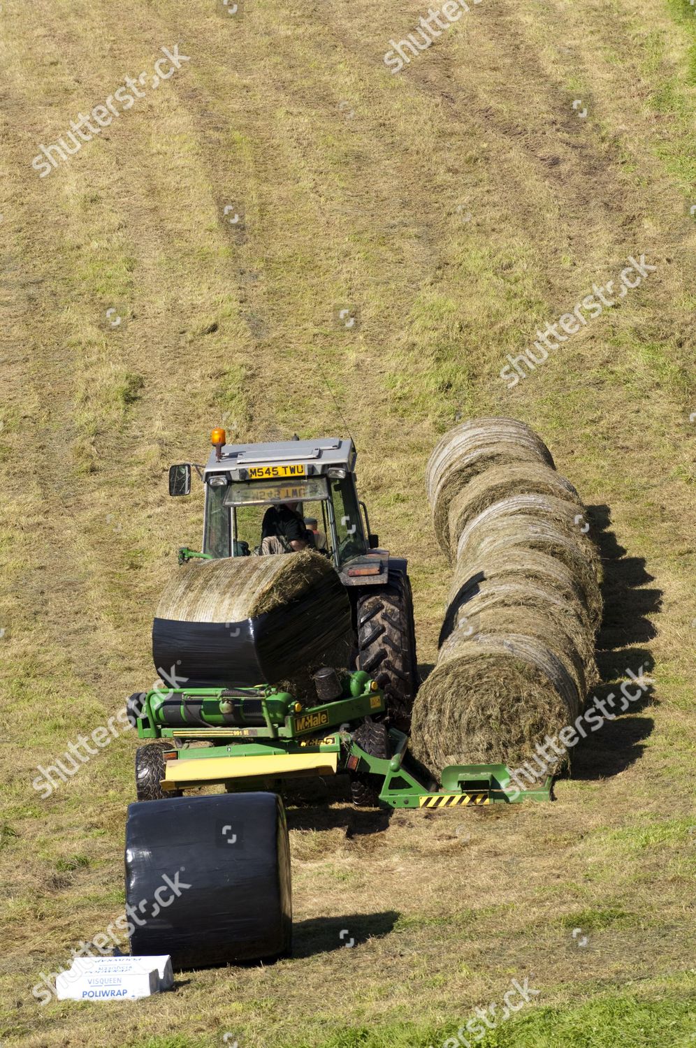Plastic Being Wrapped Around Silage Bale Editorial Stock Photo - Stock ...