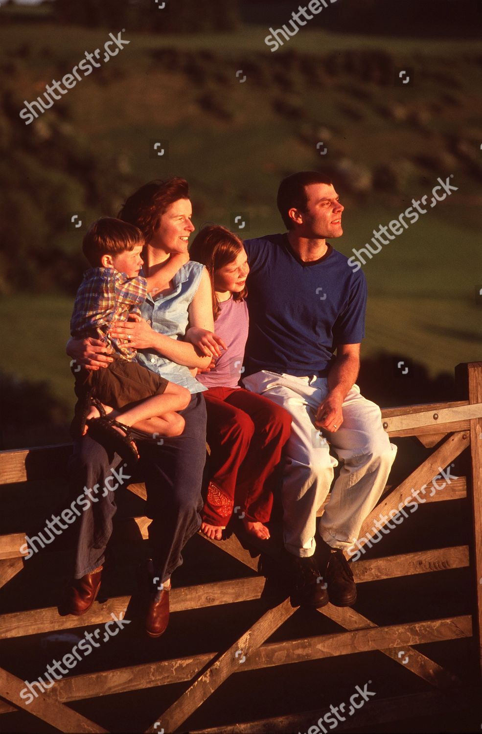 Family Sitting On Gate Country Together Editorial Stock Photo - Stock ...