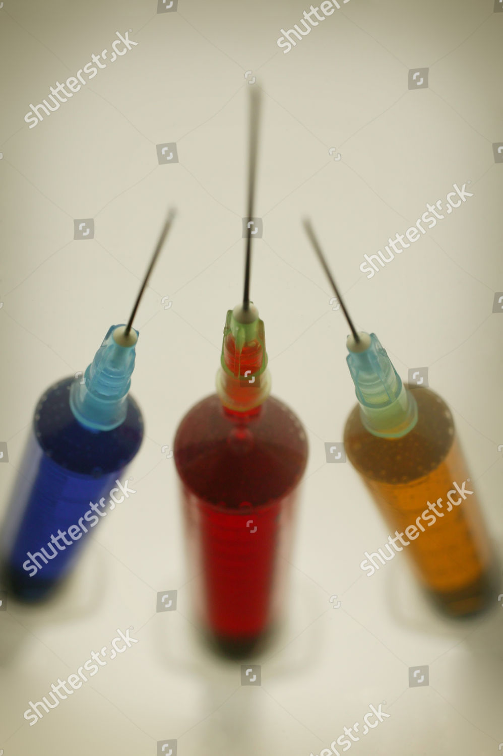Three Syringes Containg Different Coloured Solutions Editorial Stock ...