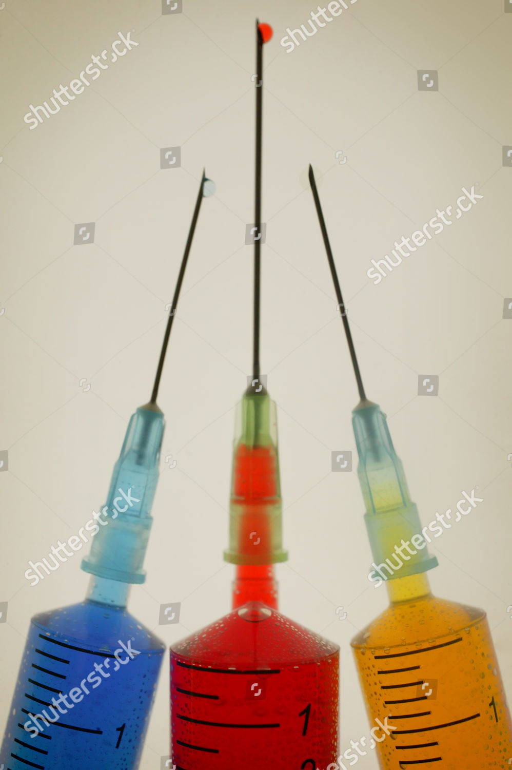 Three Syringes Containg Different Coloured Solutions Editorial Stock ...