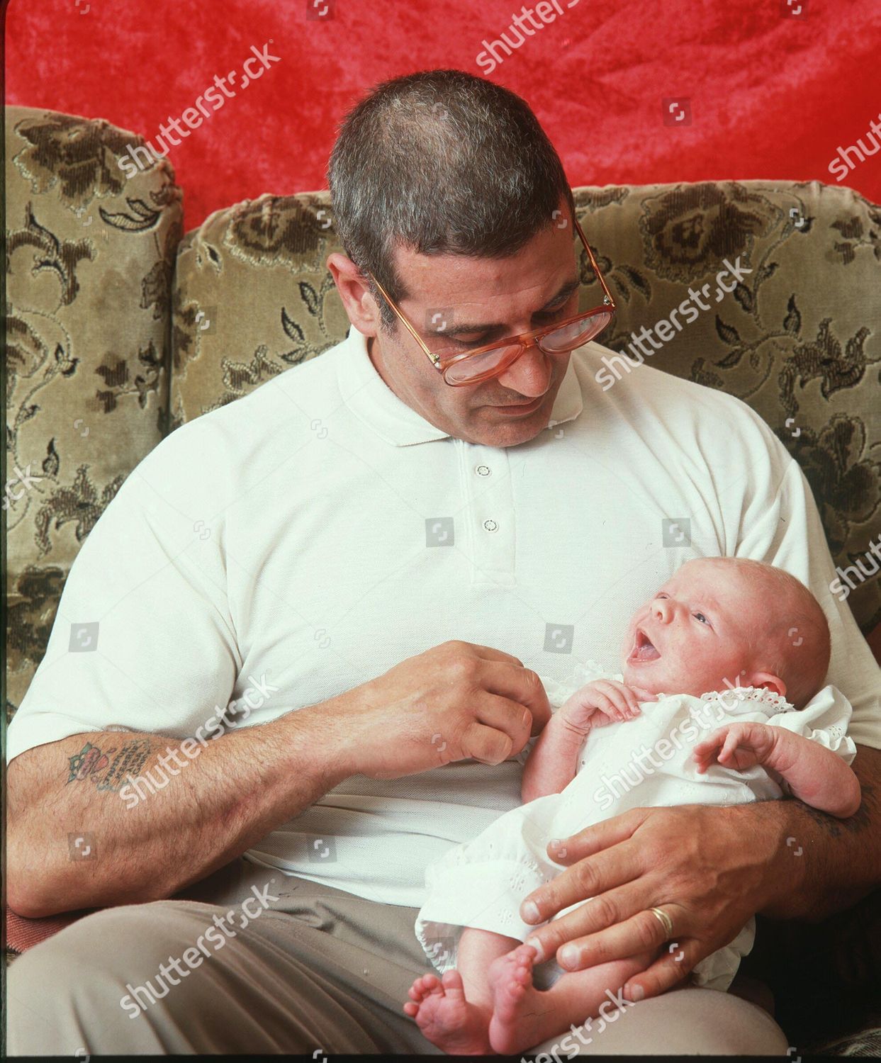Model Released Man Cradling Baby Editorial Stock Photo - Stock Image ...