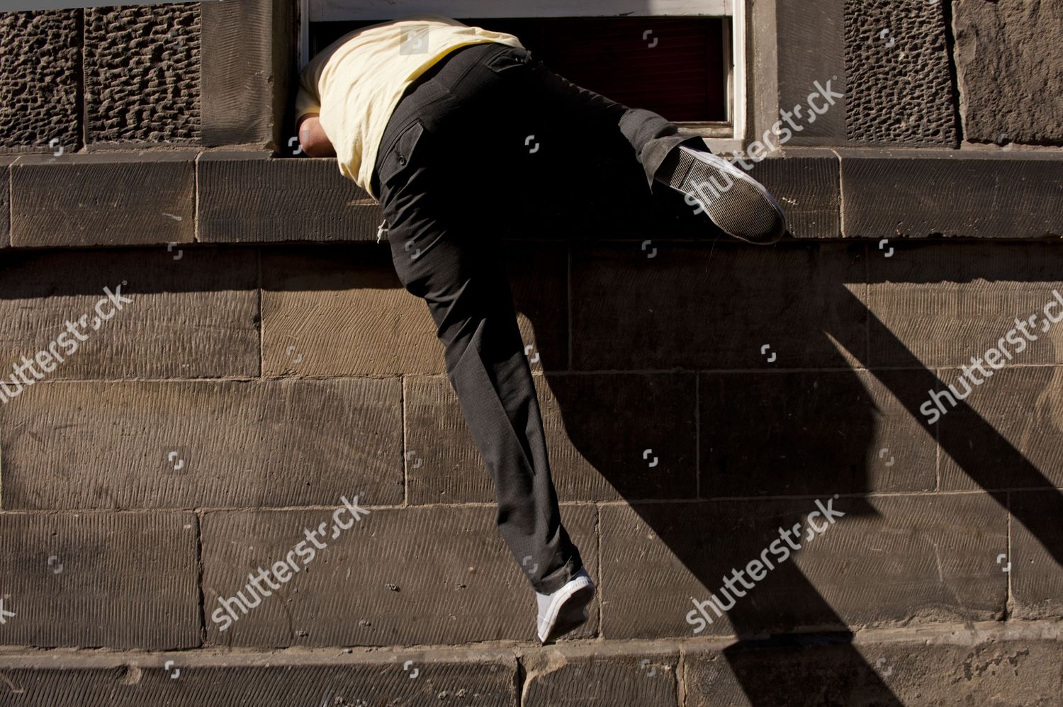 Man Climbs Through Window Editorial Stock Photo - Stock Image ...