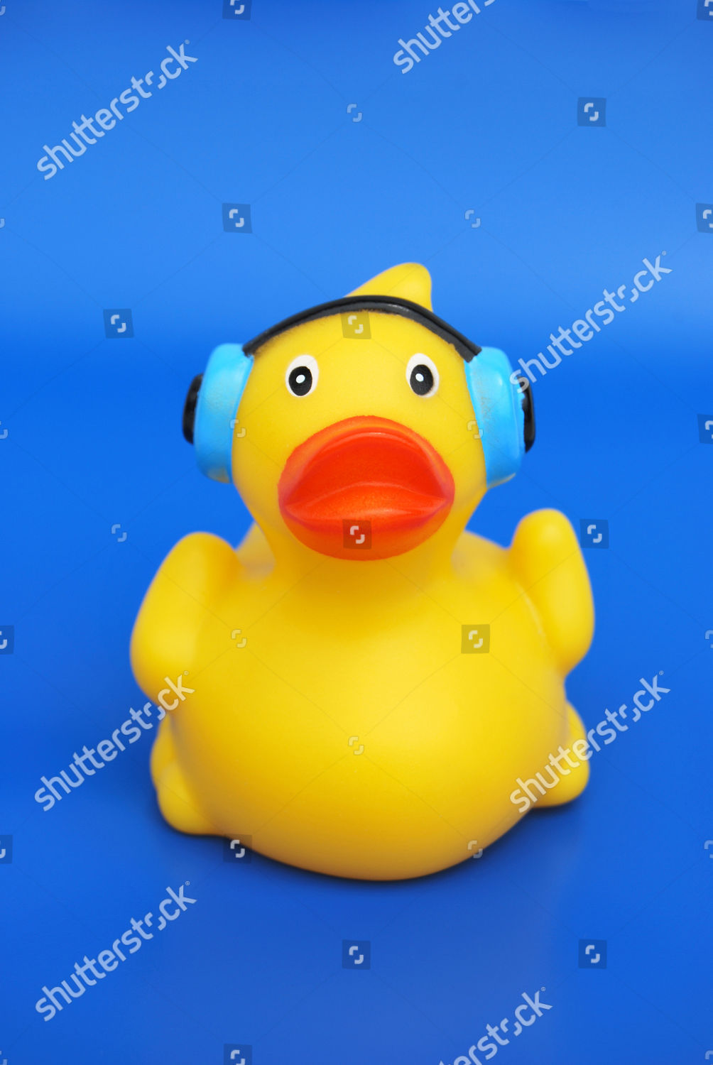YELLOW RUBBER DUCK HEADPHONES SYMBOLIC IMAGE Editorial Stock Photo ...