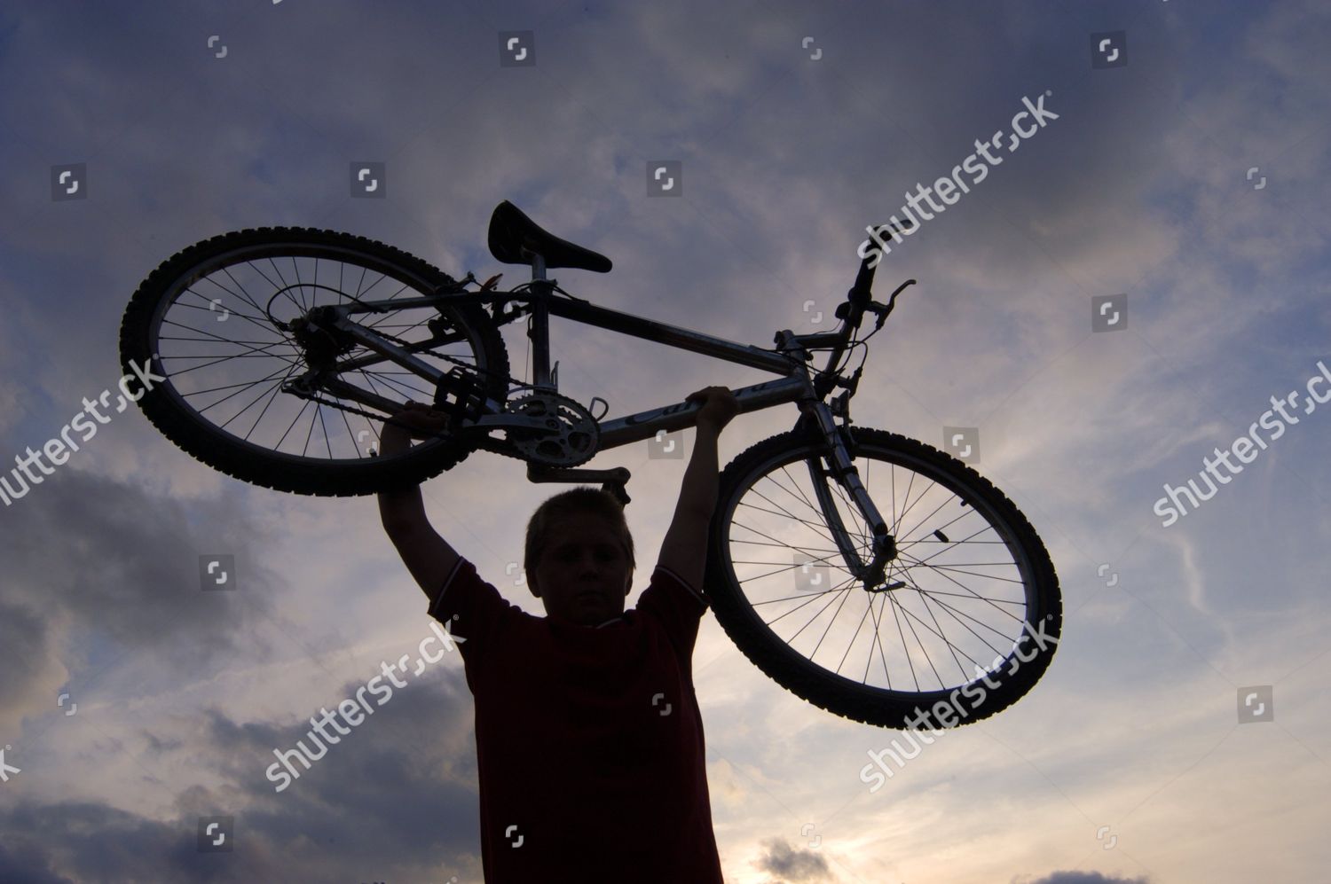 Boy Holding Bicycle Above His Head Editorial Stock Photo - Stock Image ...