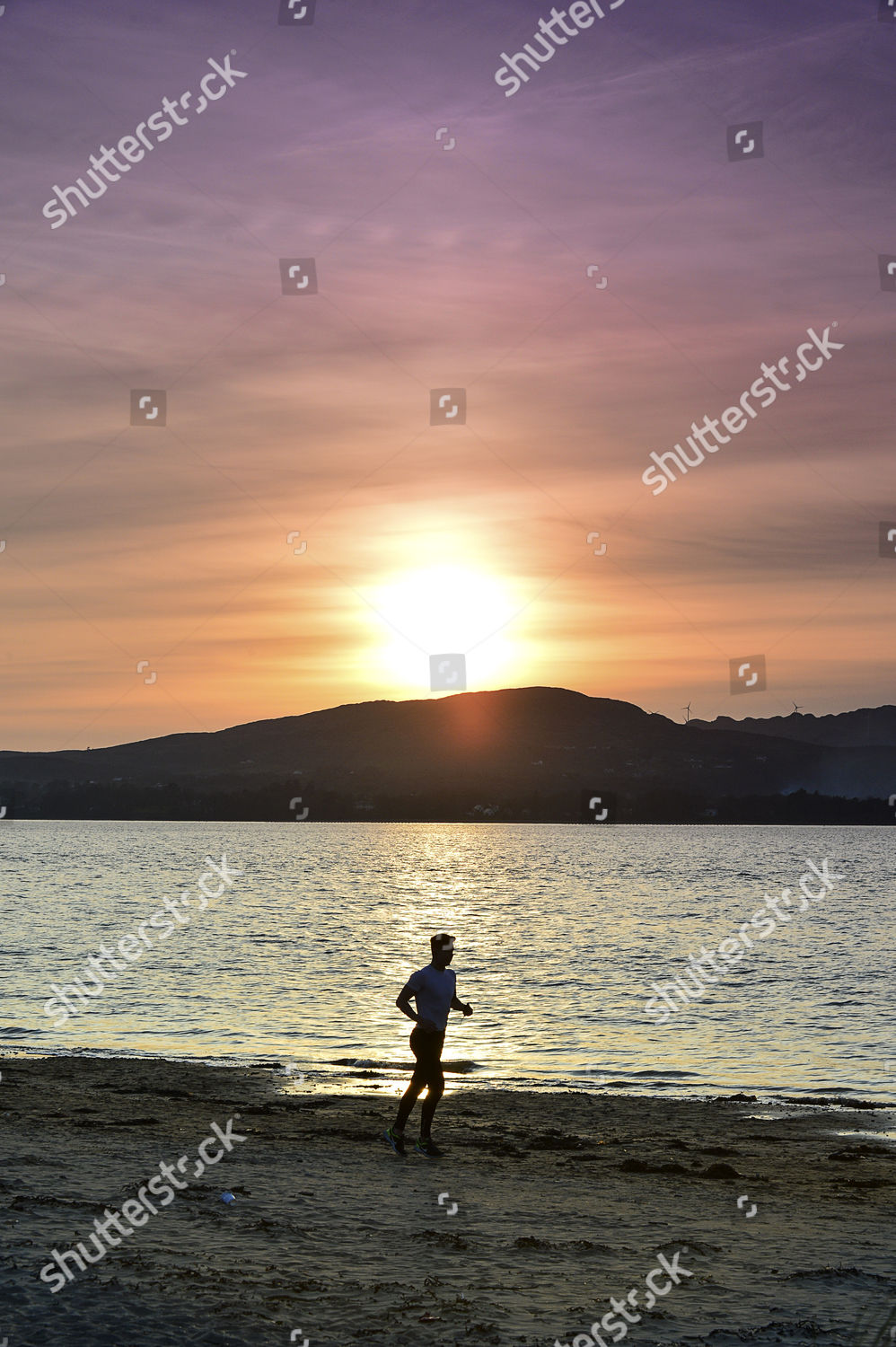 Man Jogging On Fahan Beach Editorial Stock Photo - Stock Image ...