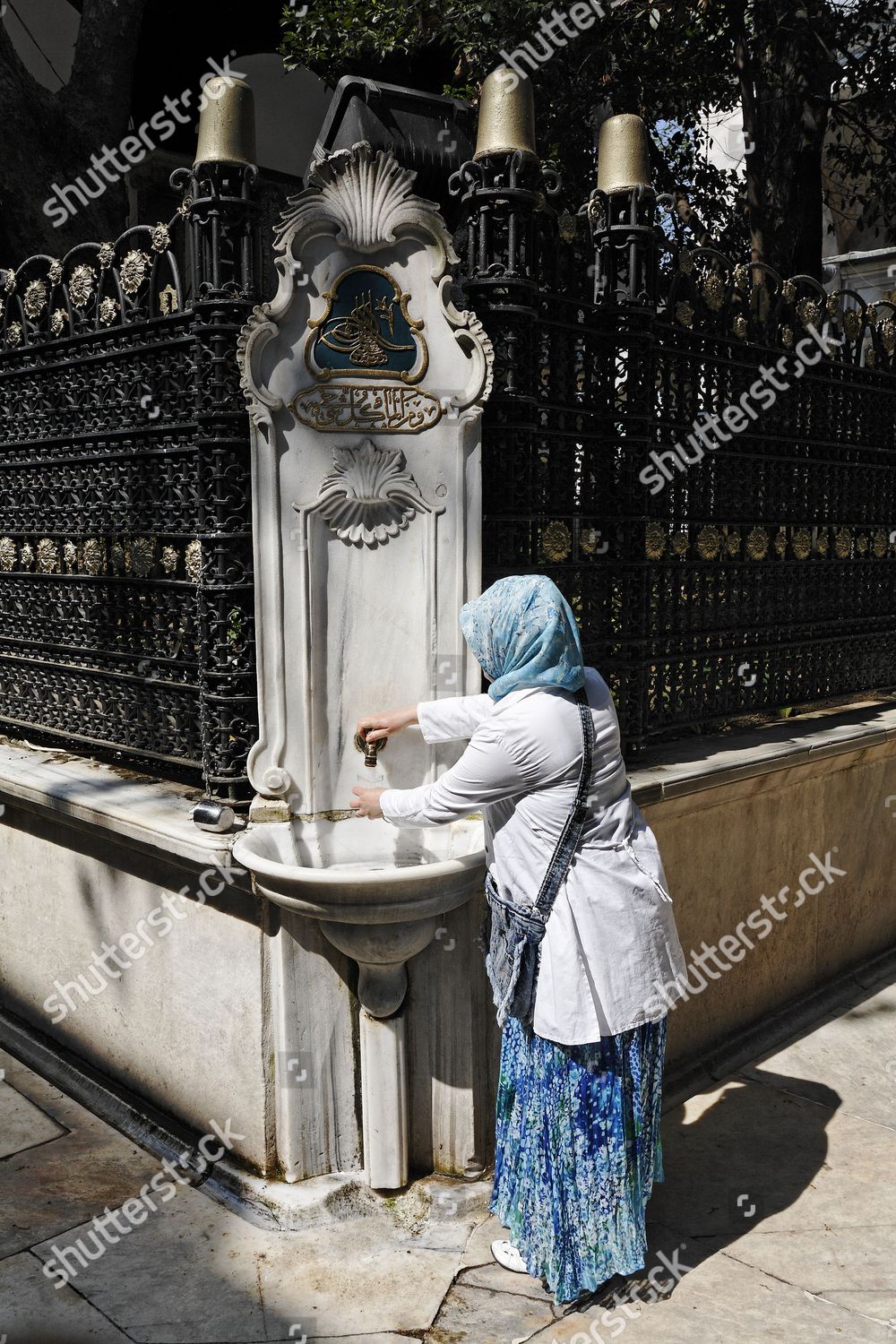 Devout Muslim Woman Filling Water Cups Editorial Stock Photo - Stock ...