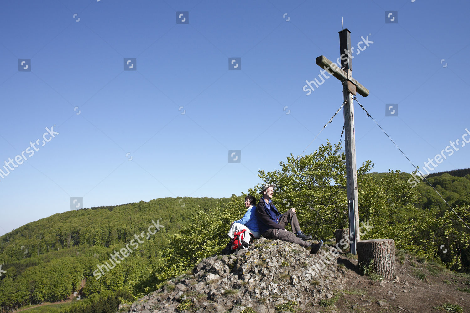 Model Released Couple Sitting Under Cross Editorial Stock Photo - Stock ...
