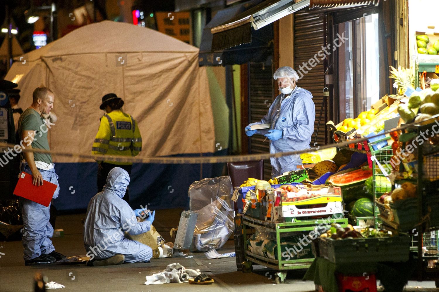 Forensic Officers Investigating Crime Scene On Editorial Stock Photo ...