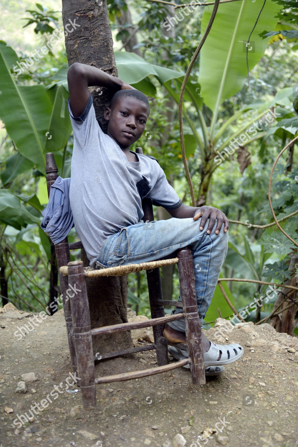 Teenager Boy On Rickety Chair Riviere Editorial Stock Photo - Stock ...