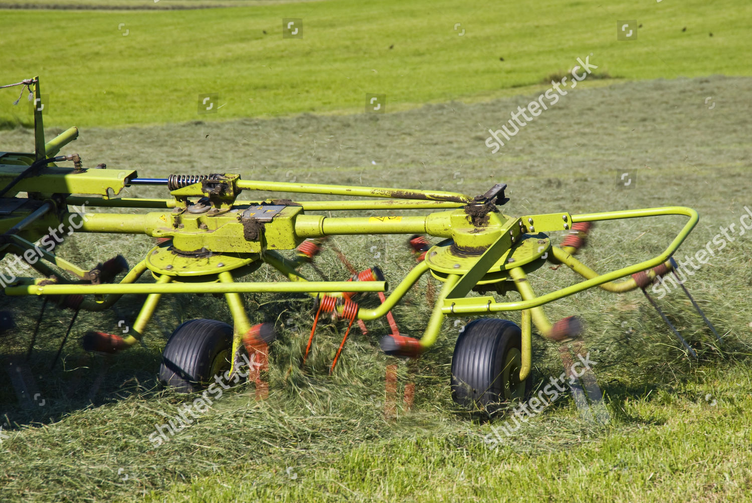 Tractor Making Hay On Meadows Editorial Stock Photo - Stock Image ...