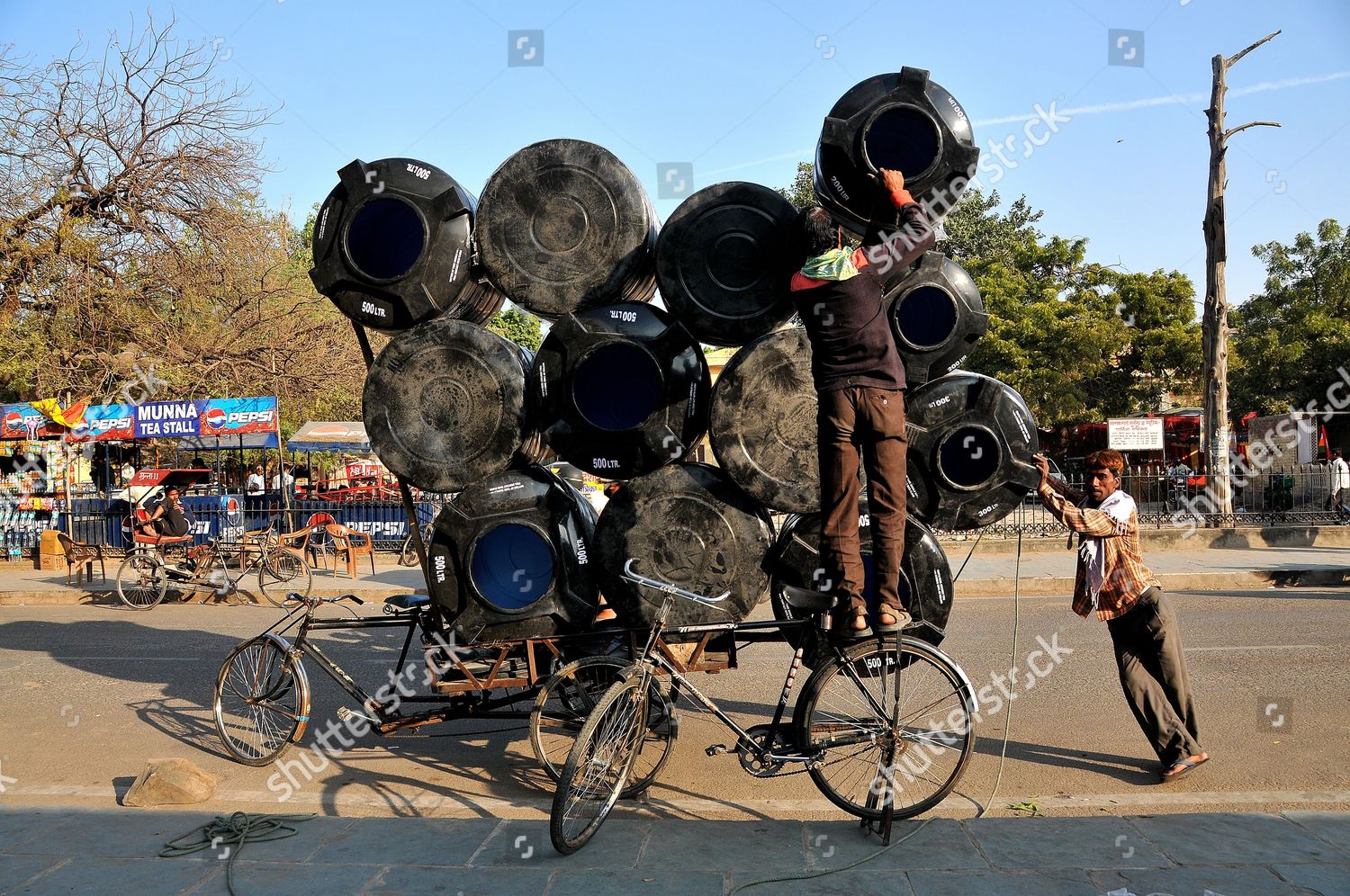 Men Loading Water Tanks On Bicycle Editorial Stock Photo - Stock Image ...