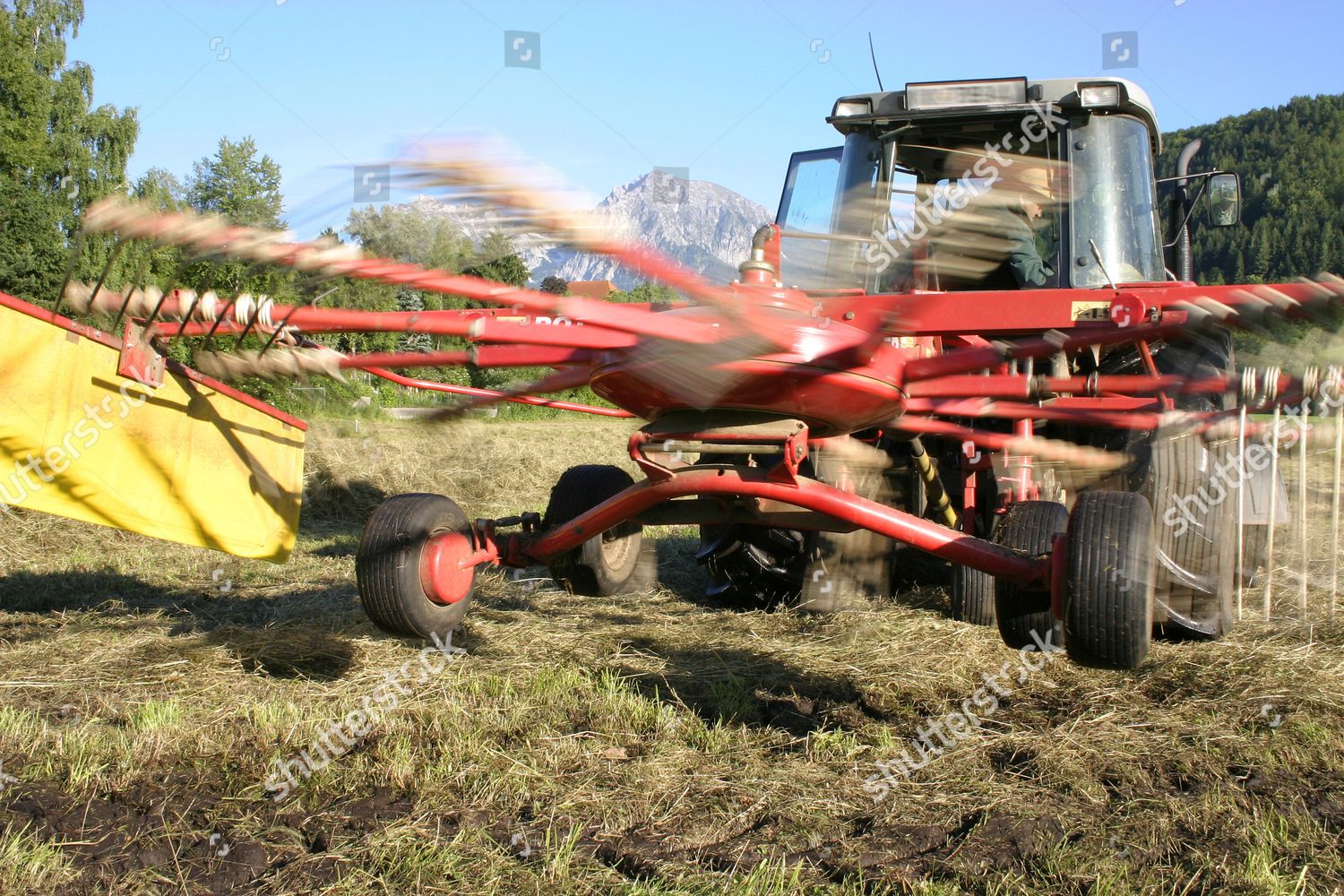 Red Tractor Rotating Hay Rake Motion Editorial Stock Photo - Stock ...
