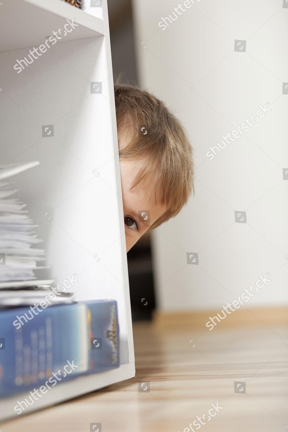Model Released Boy Hiding Behind Shelf Editorial Stock Photo - Stock ...