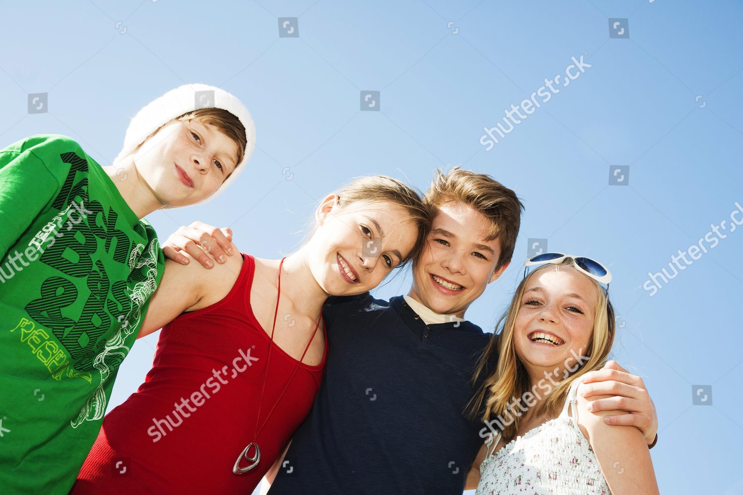 MODEL RELEASED FOUR FRIENDS STANDING NEXT Editorial Stock Photo - Stock ...