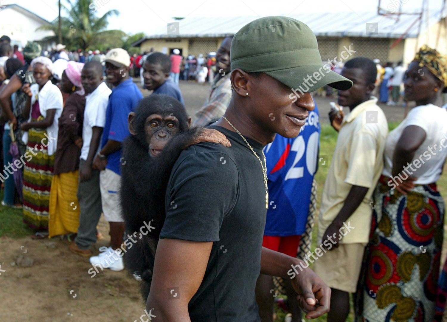 Liberian Man Carrying Monkey Takes His Editorial Stock Photo - Stock ...
