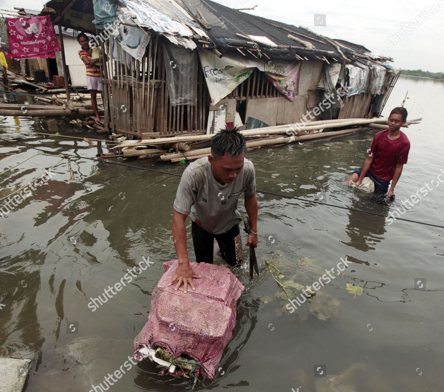 Filipino Residents Wade Through Flood Waters Editorial Stock Photo - Stock Image | Shutterstock