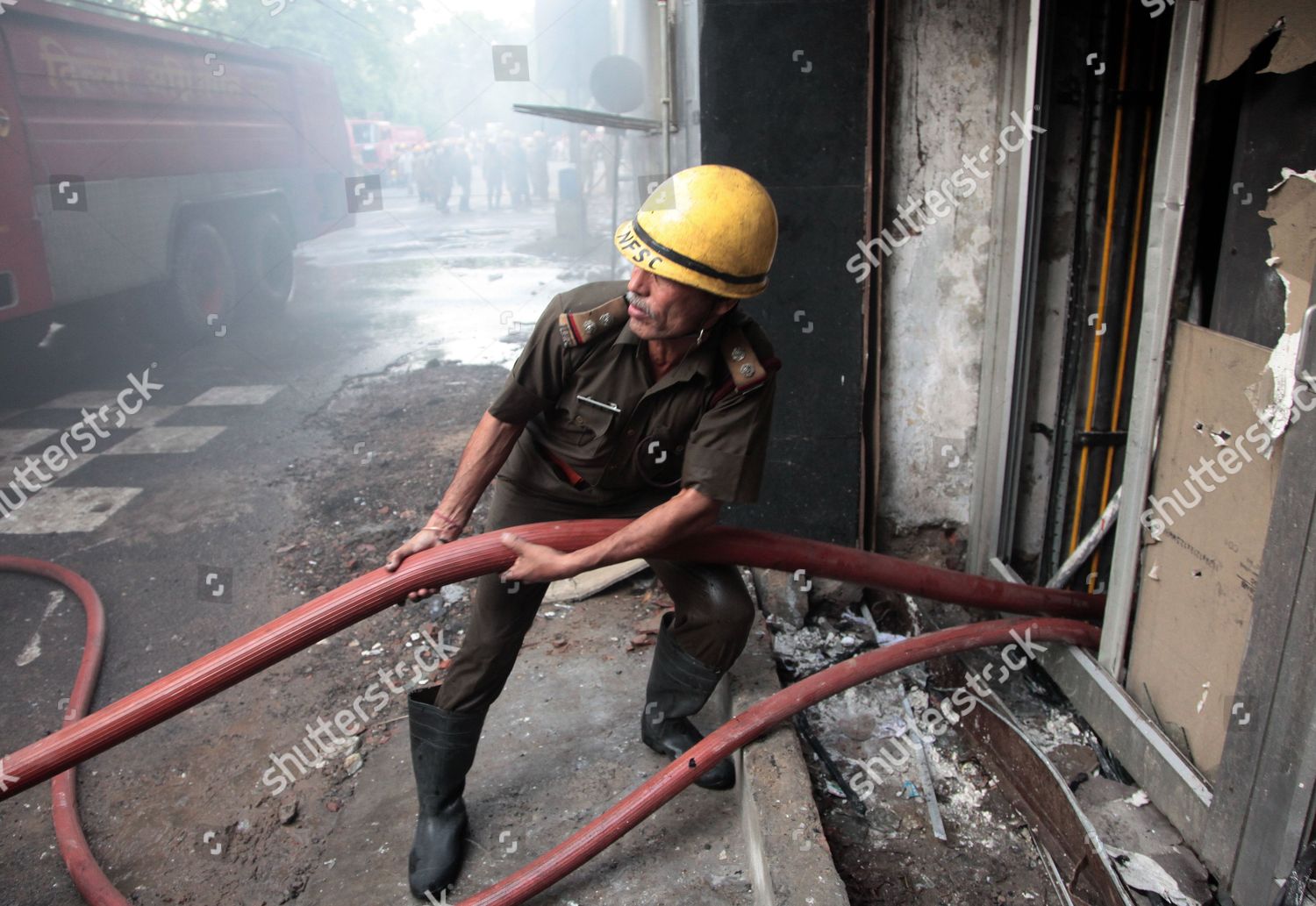 Indian Fire Fighter Tries Extinguish Fire Editorial Stock Photo - Stock ...