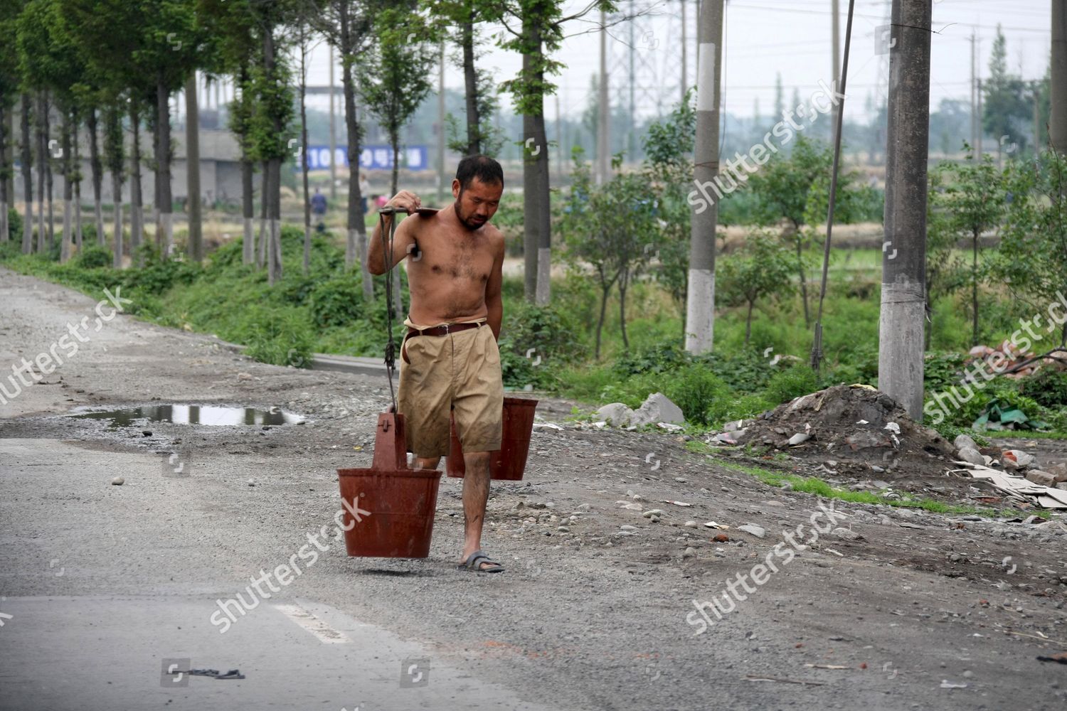 Local Man Carrying Water Editorial Stock Photo - Stock Image | Shutterstock