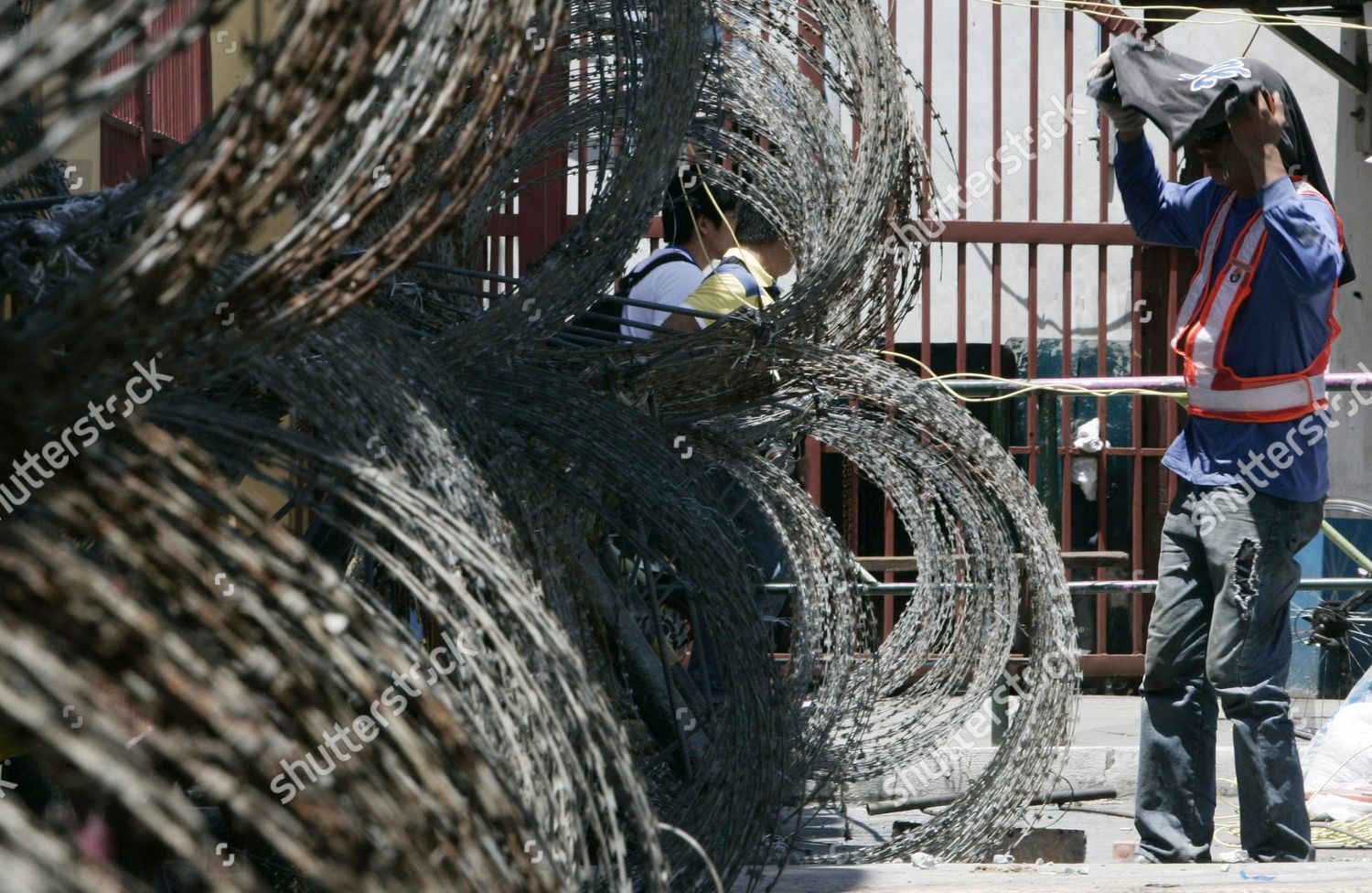 Filipino Worker Checks On Steel Barrier Editorial Stock Photo - Stock ...