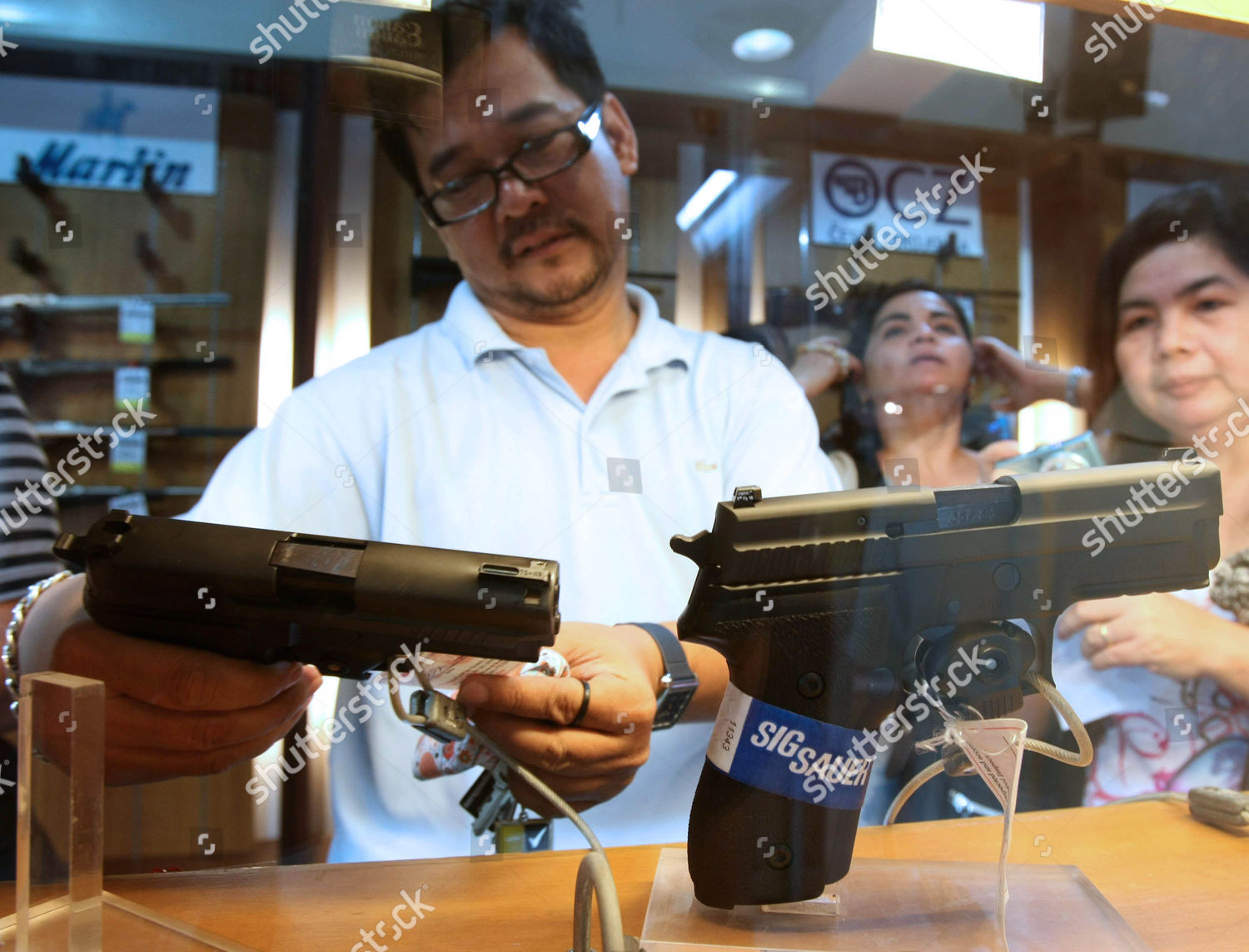 FILIPINO CHECKS HANDGUN OPENING 2010 DEFENSE Editorial Stock Photo ...