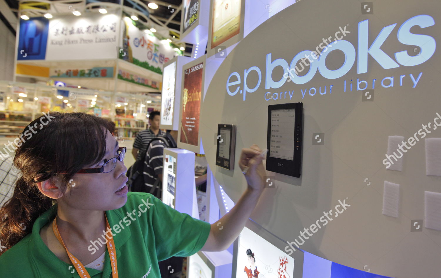 Exhibitor Shows Ebooks Booth During First Editorial Stock Photo - Stock ...