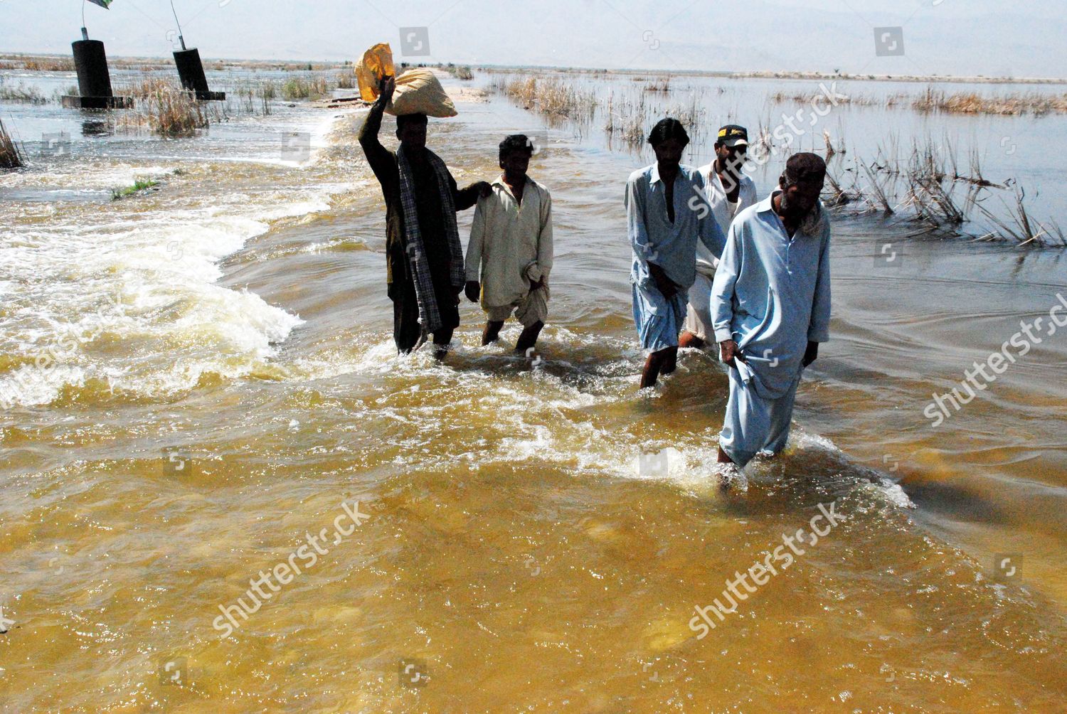 PEOPLE WADE THROUGH WATER THEY FLEE Editorial Stock Photo - Stock Image ...