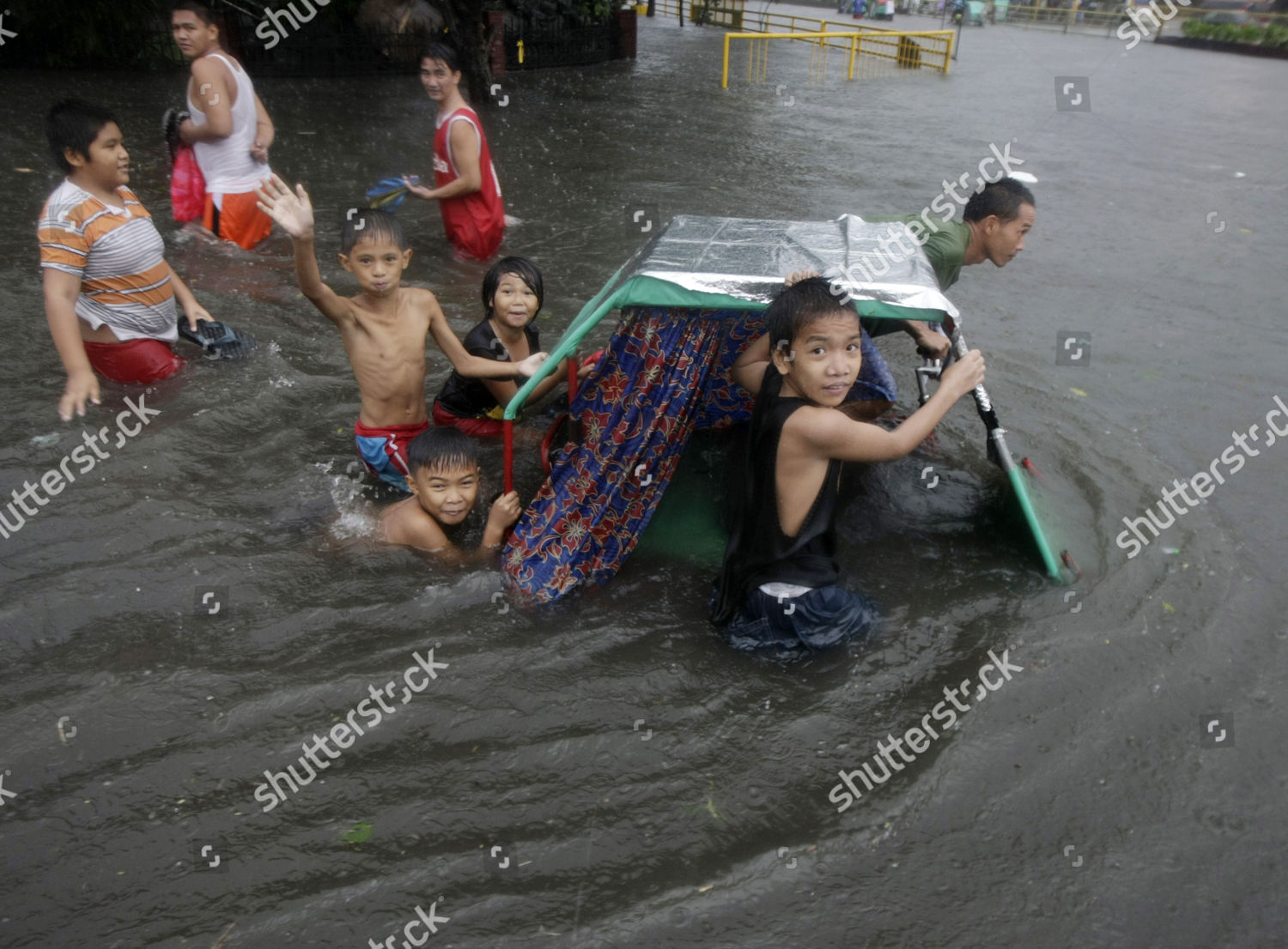 Filipino Residents Wade Through Flooded Street Editorial Stock Photo - Stock Image | Shutterstock
