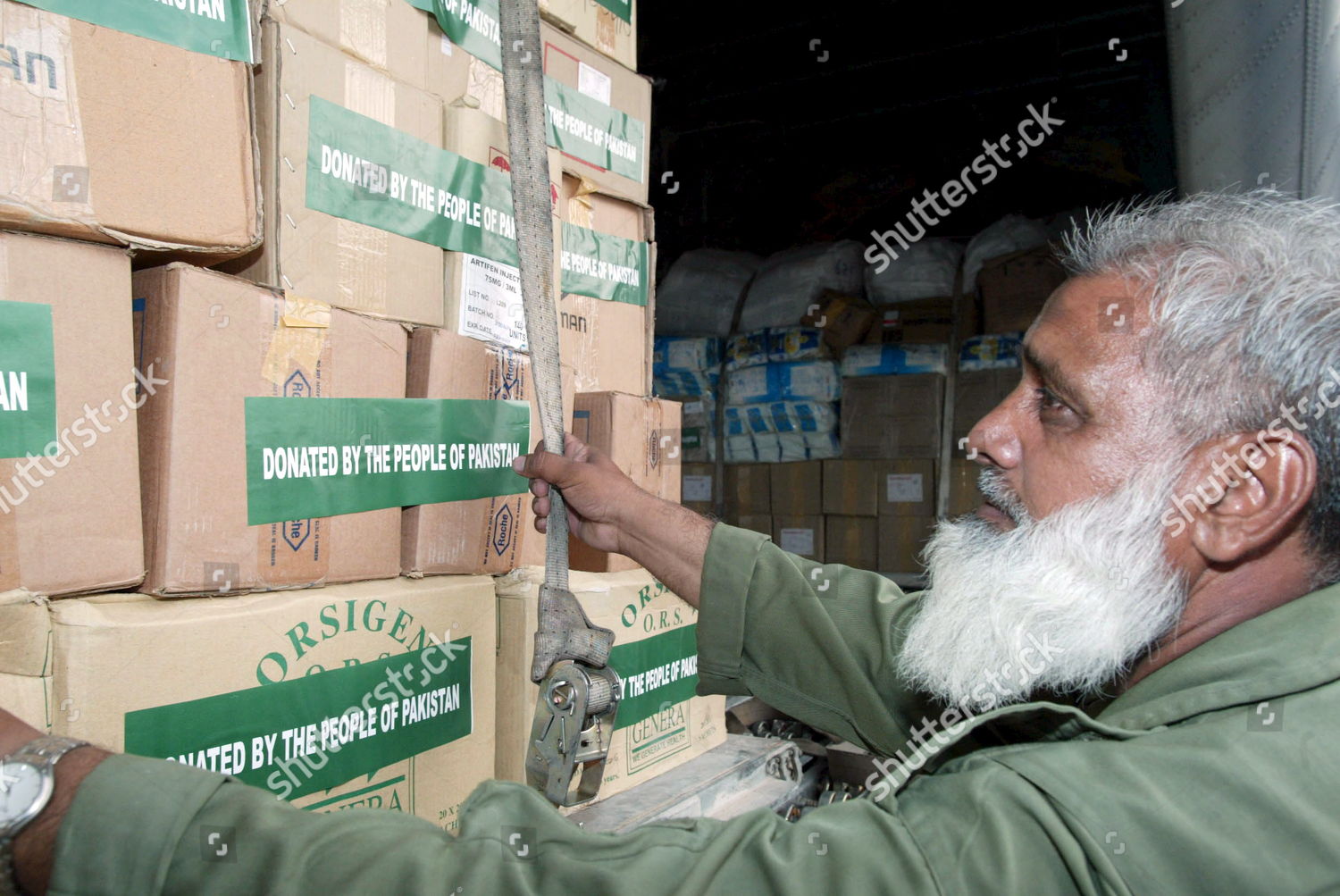 Pakistani Worker Loads Relief Goods On Editorial Stock Photo - Stock ...