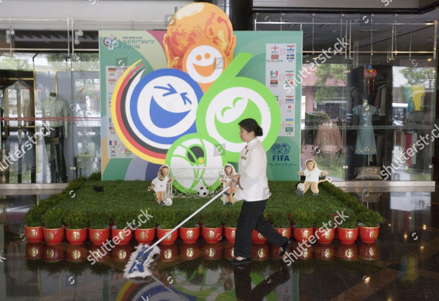 Cleaner Pushes Her Mop Past Display Editorial Stock Photo - Stock Image ...