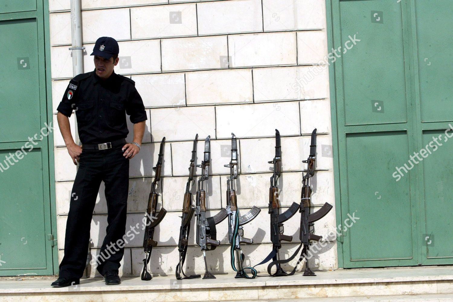 Palestinian Police Officer Stands Next Rifles Editorial Stock Photo ...
