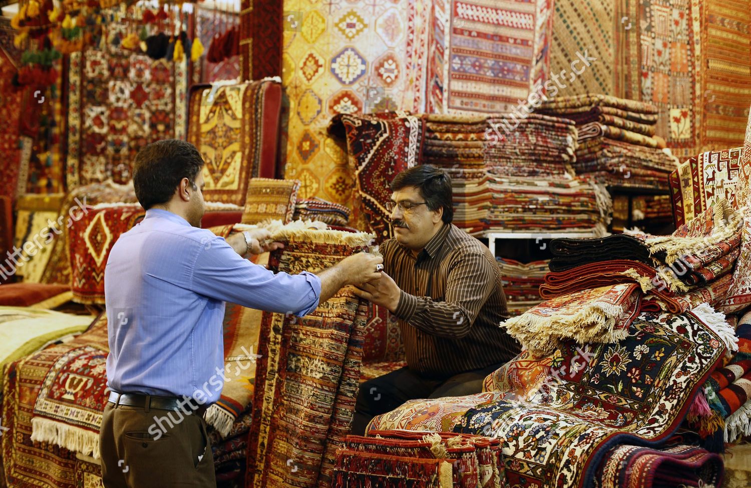 Iranian Carpet Sellers Adjust Their Wares Editorial Stock Photo - Stock ...