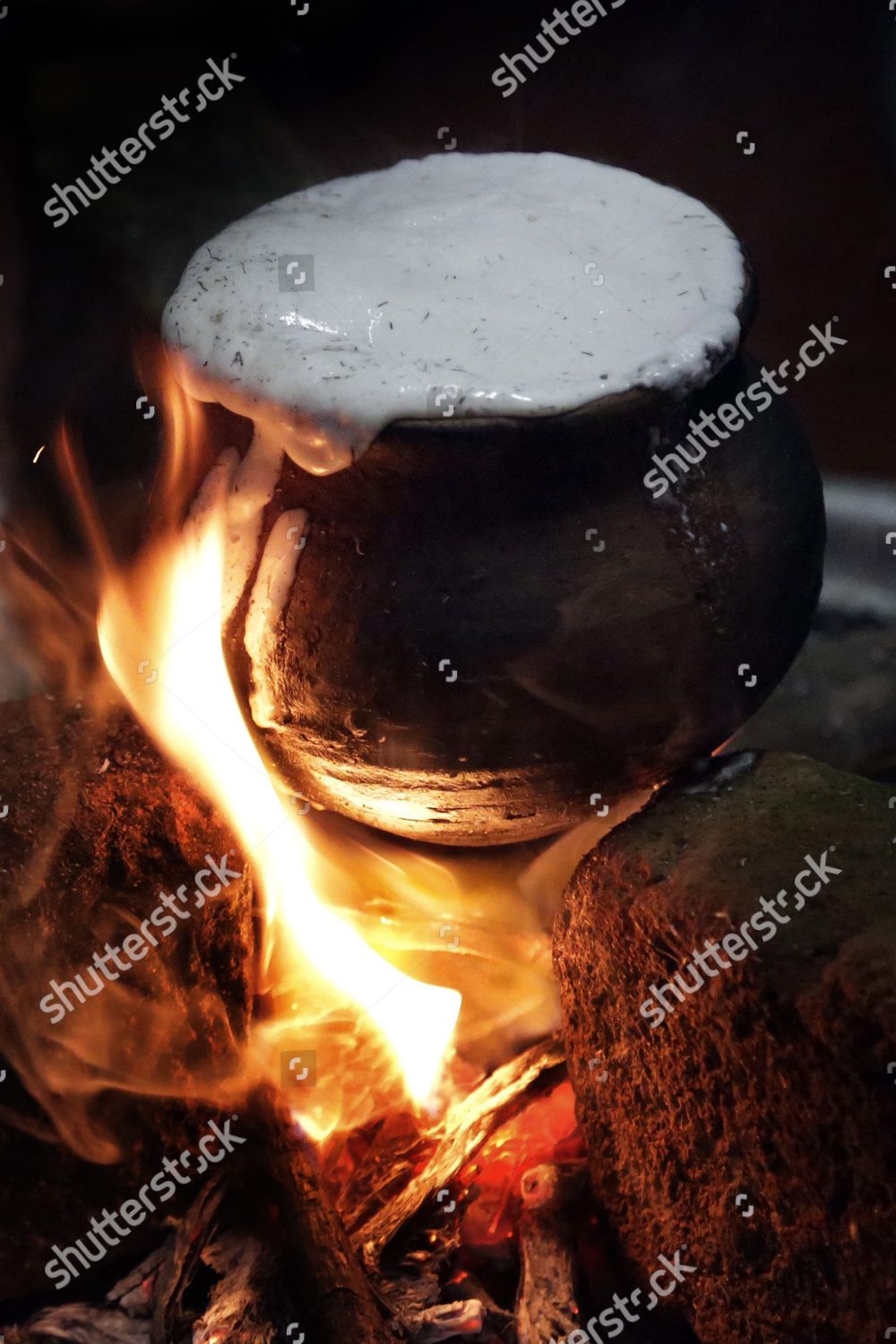 Boiling Milk Overflows On Hearth During Editorial Stock Photo - Stock ...