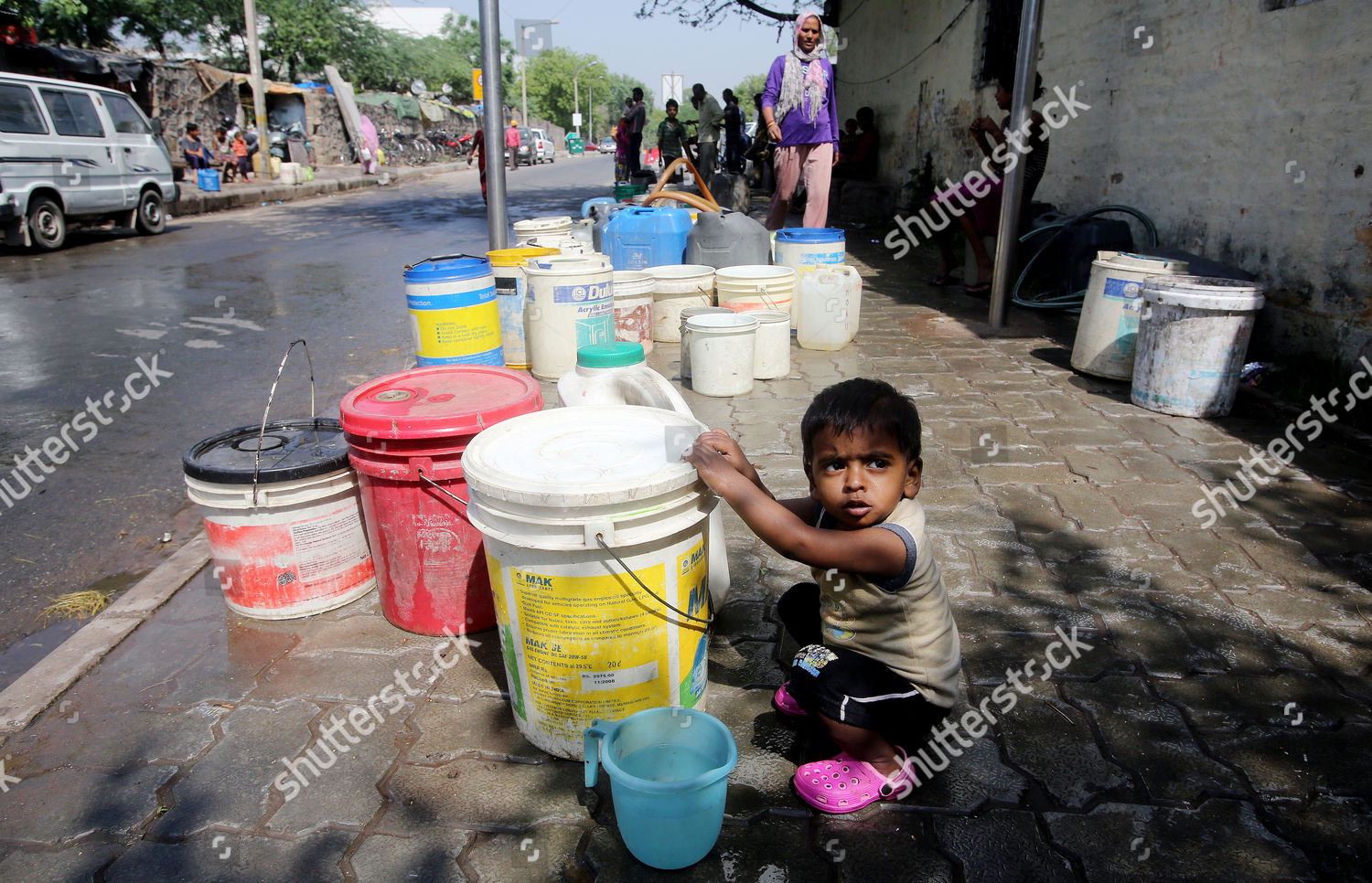 Indian Child Plays Around Buckets Filled Editorial Stock Photo - Stock ...