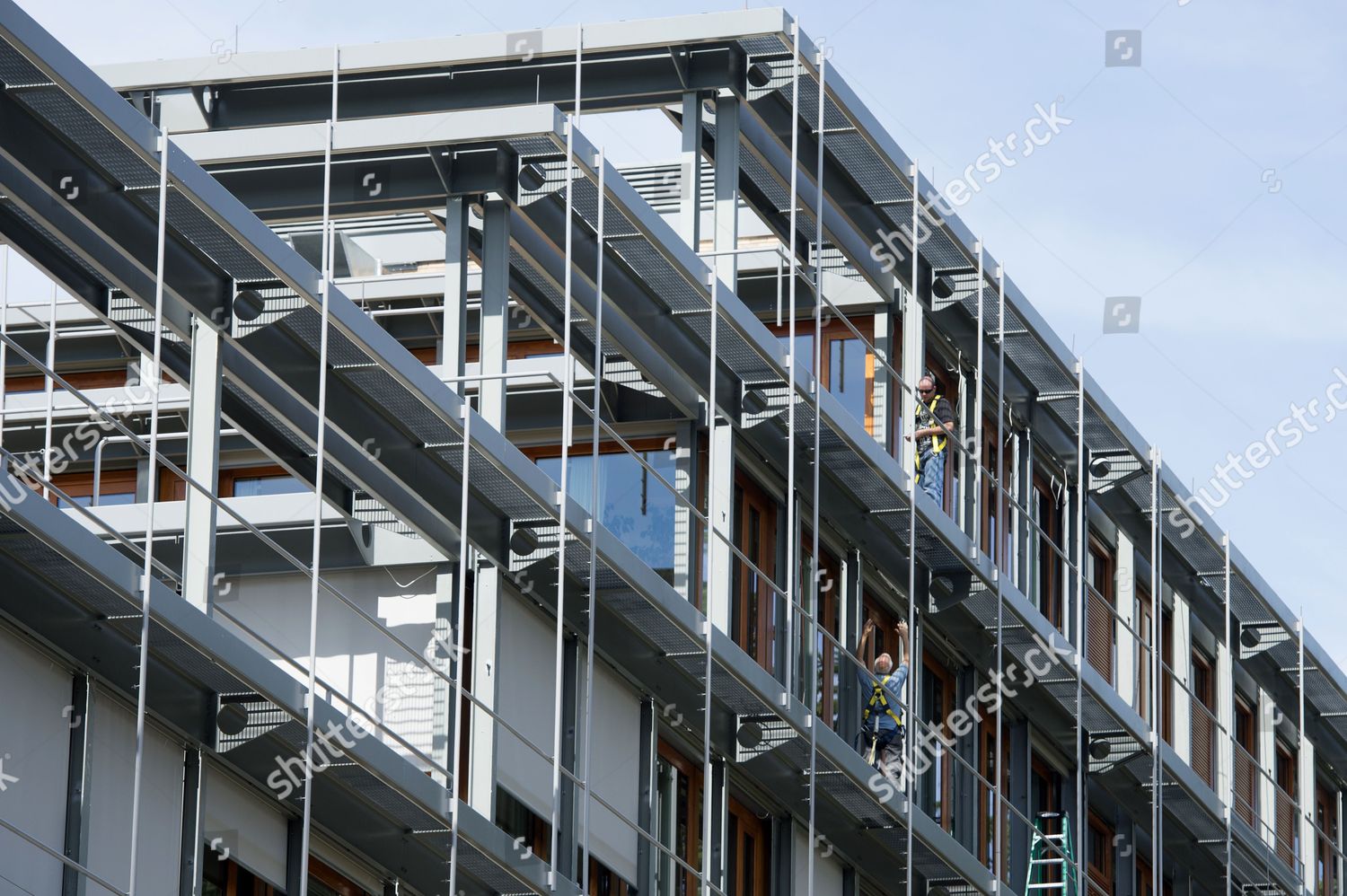 CONSTRUCTION WORKERS WORK ON WINDOW SHADES Editorial Stock Photo ...