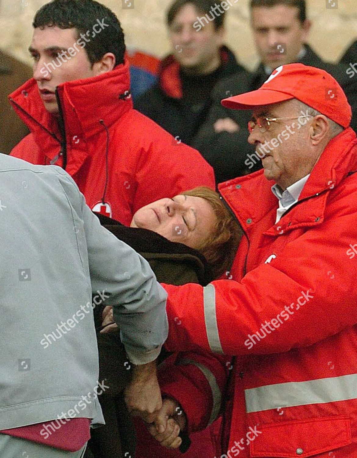 Red Cross Workers Carry Fainted Woman Editorial Stock Photo - Stock ...