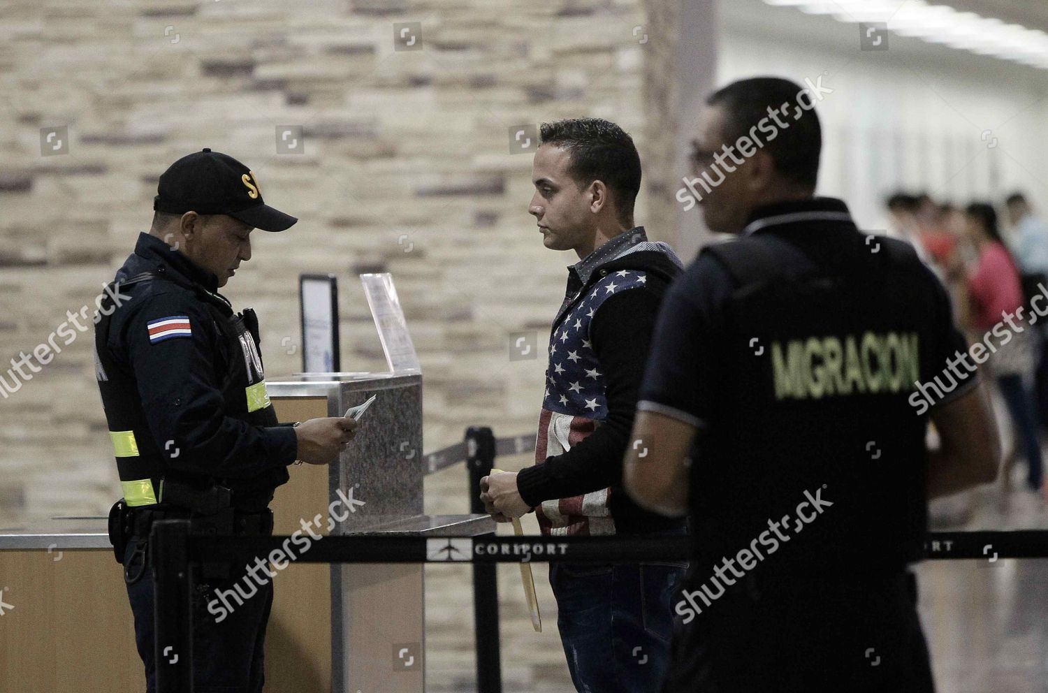 Costa Rican Policemen Check Cuban Citizen Editorial Stock Photo - Stock ...