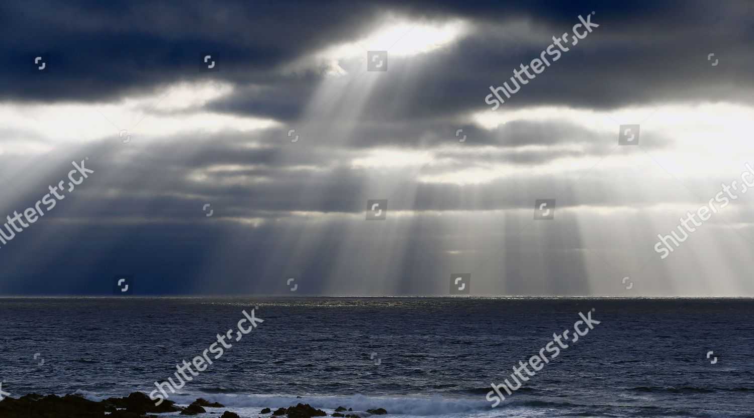 Sun Rays Emerge Trough Thick Clouds Editorial Stock Photo - Stock Image ...