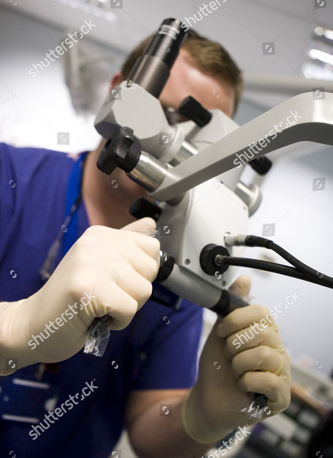 Doctor Looks Through Surgery Microscope Nhs Editorial Stock Photo ...